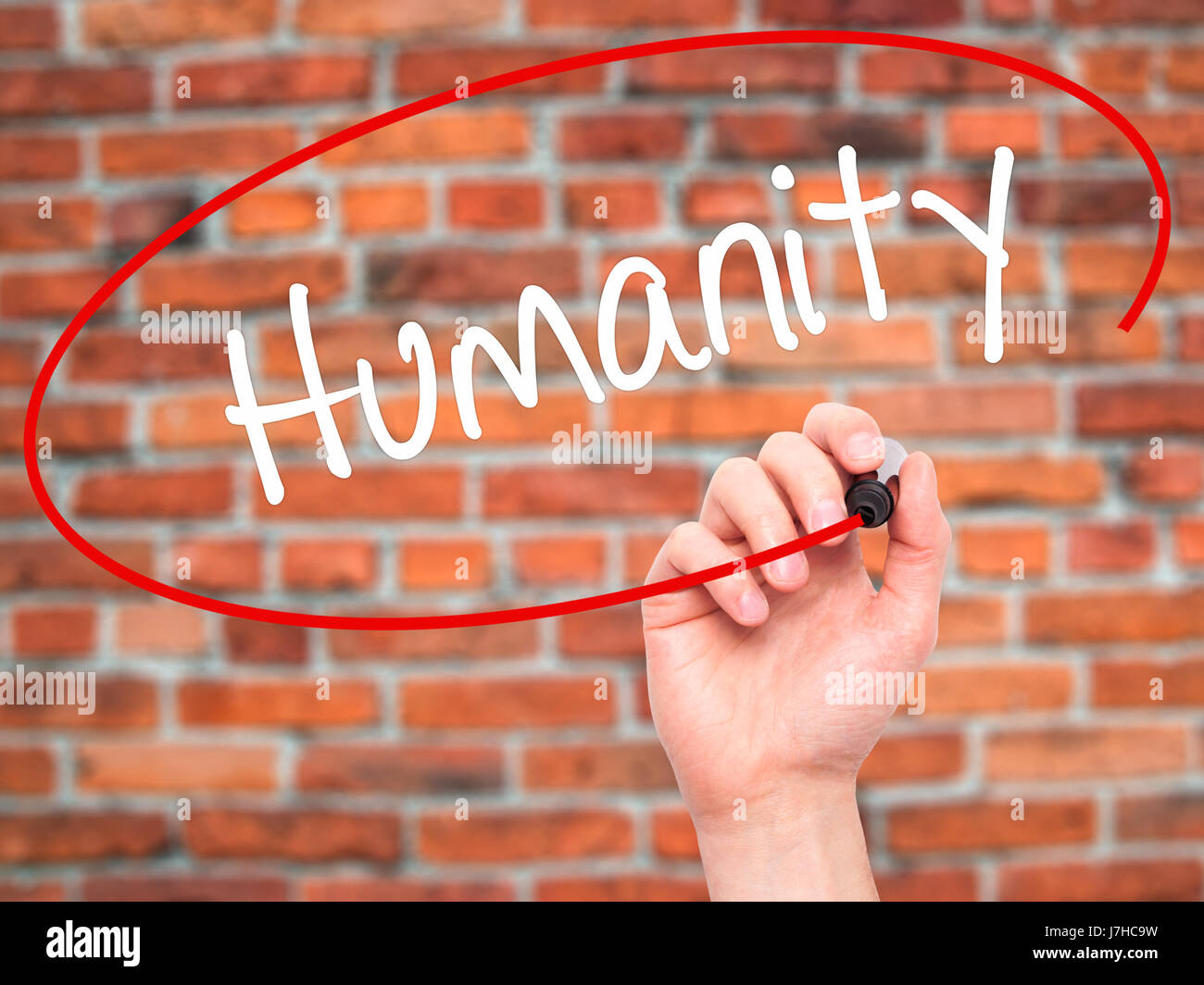 Man Hand writing Humanity with black marker on visual screen. Isolated ...