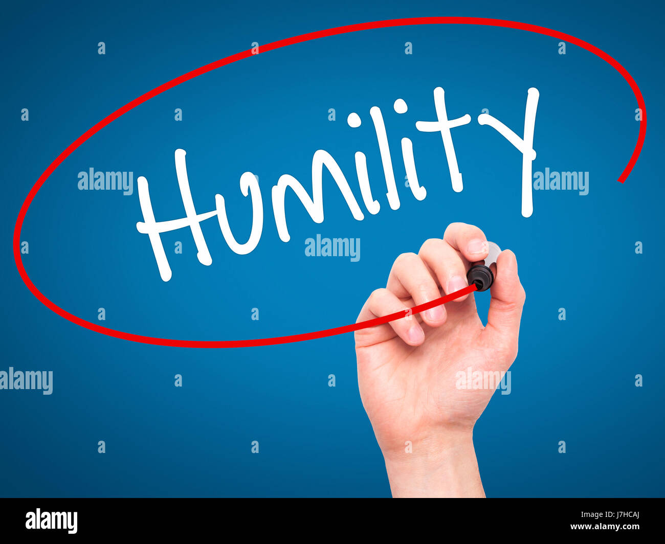 Man Hand writing Humility with black marker on visual screen. Isolated ...