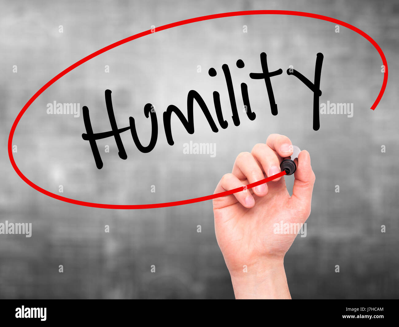 Man Hand writing Humility with black marker on visual screen. Isolated ...