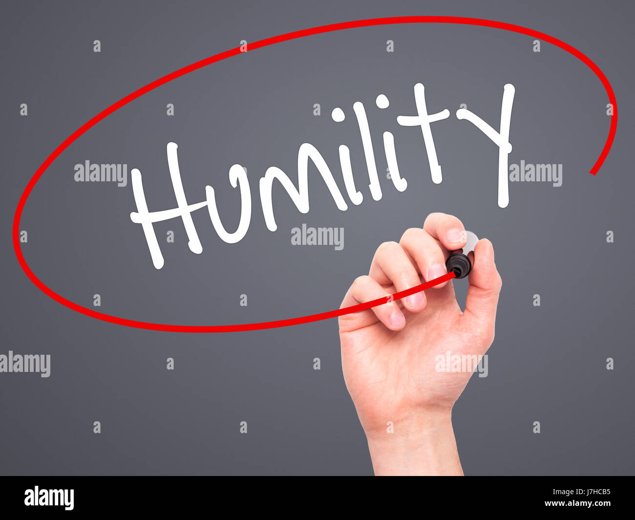 Man Hand writing Humility with black marker on visual screen. Isolated ...