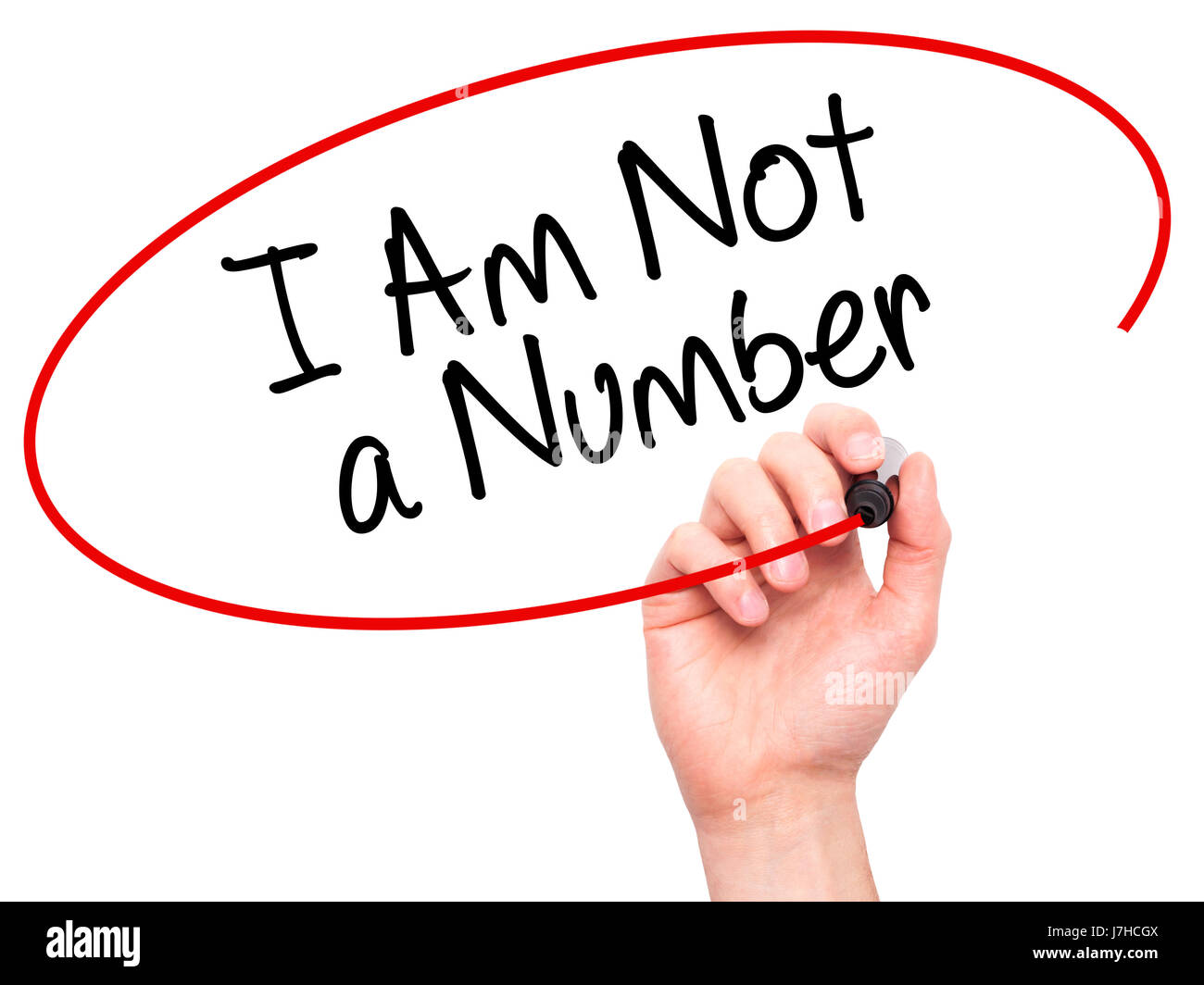 Man Hand writing I Am Not a Number with black marker on visual screen ...