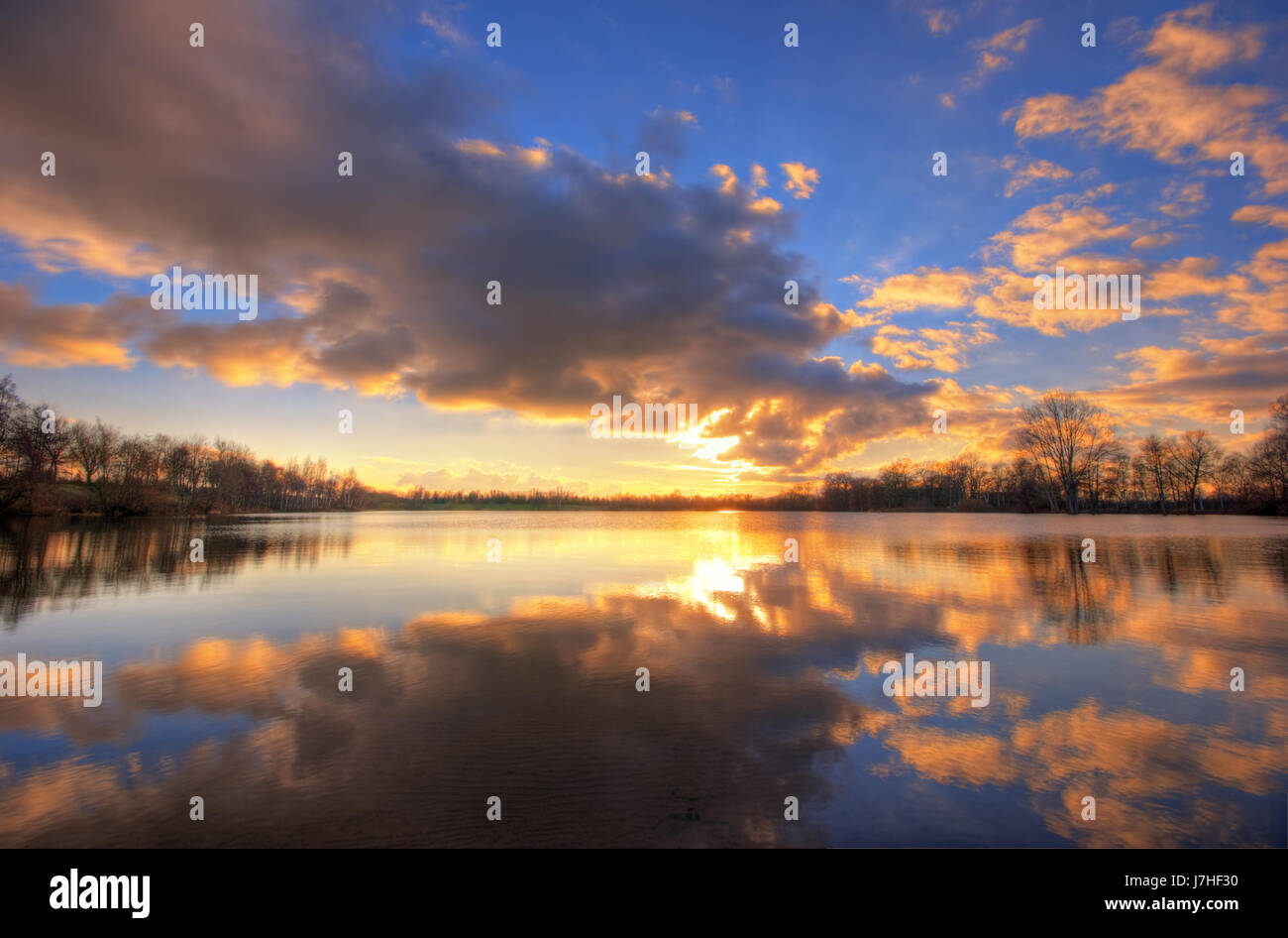 sunset on a lake Stock Photo - Alamy