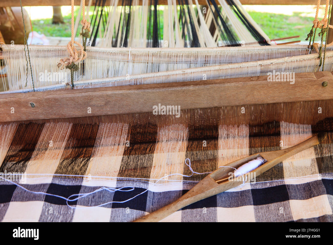 weaving shuttle on thai tradition clothes weaving Stock Photo - Alamy
