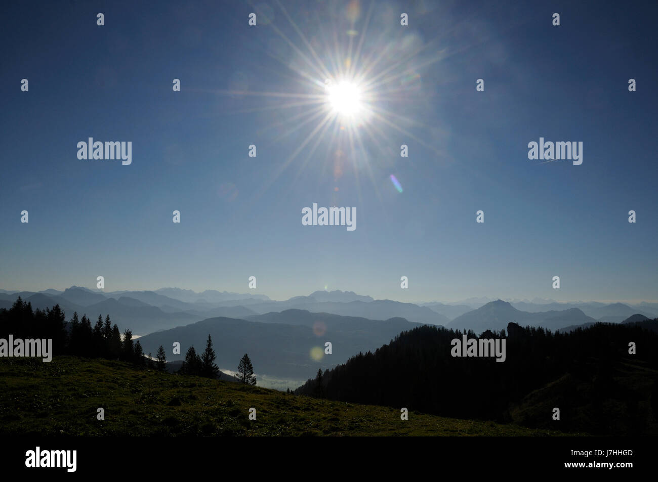 sun in the mountains Stock Photo - Alamy