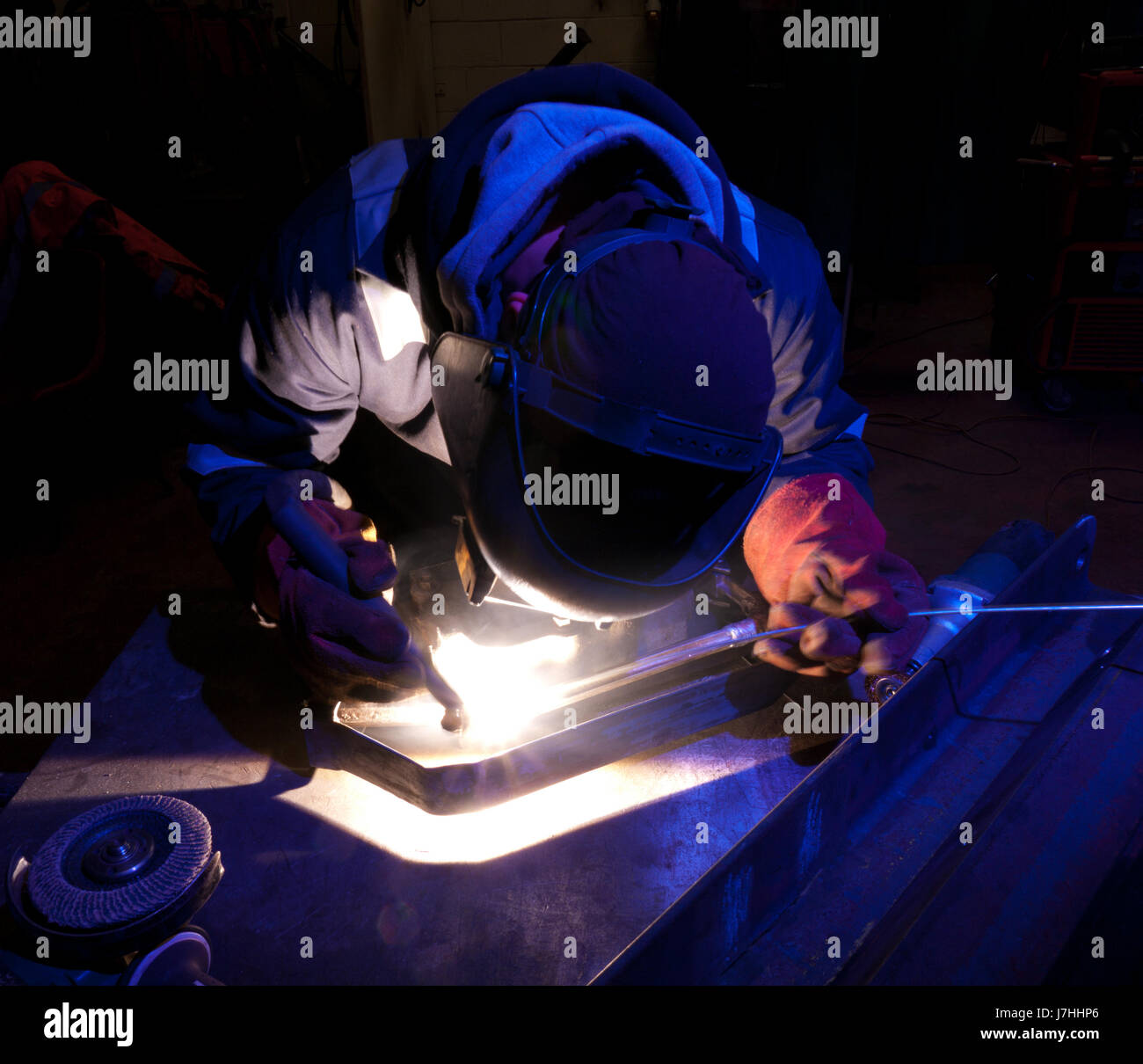 construction worker manufacturing welding sparks welder blue colour ...