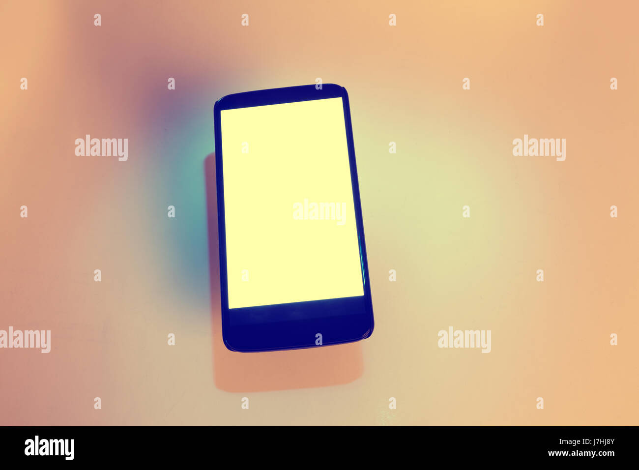 cellphone and shadow with blank screen. communication concept Stock ...