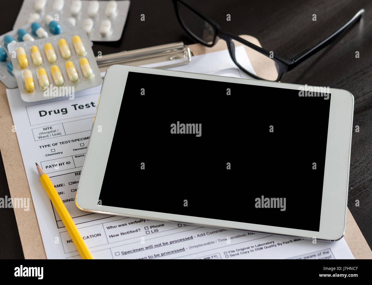 doctor desk with digital tablet with empty screen. Top view of medical ...