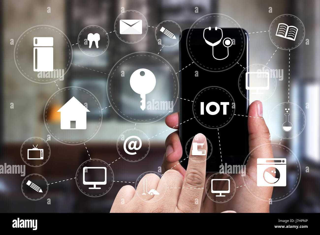 IOT business man hand working and internet of things (IoT) word diagram ...