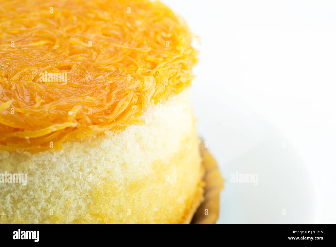 Close up of gold egg yolks thread cake on white background Stock Photo ...
