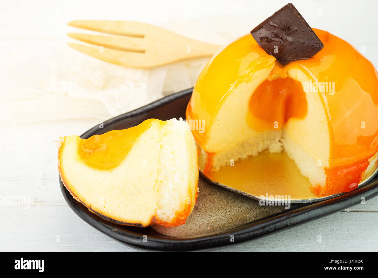 Stuffed orange cheesecake with chocolate Stock Photo - Alamy