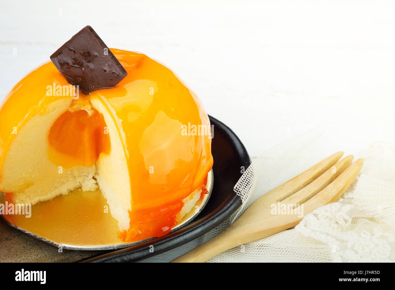 Stuffed orange cheesecake with chocolate Stock Photo - Alamy