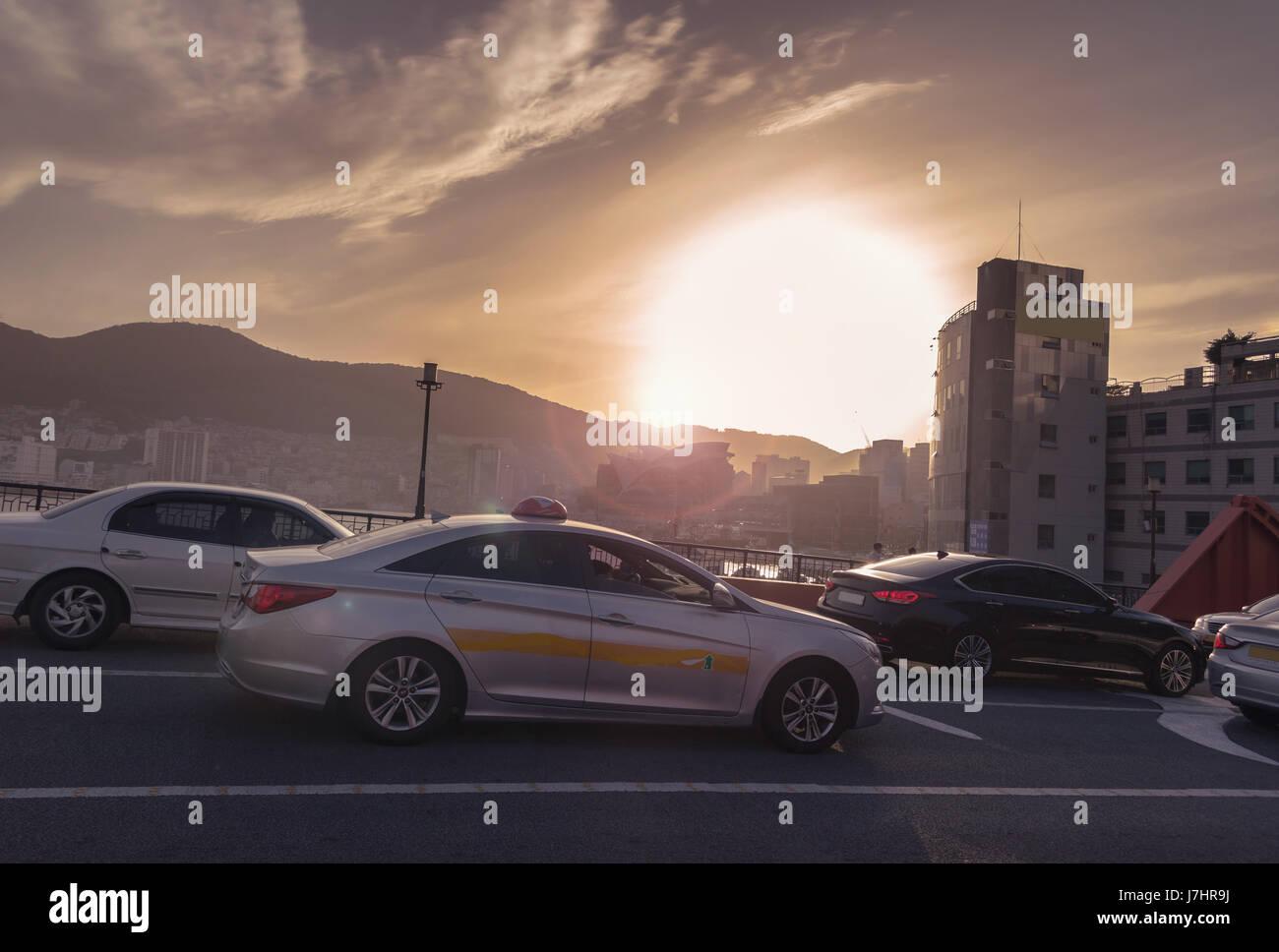 sunset view on Yeongdodaegyo Bridge with traffic jam and Busan ...