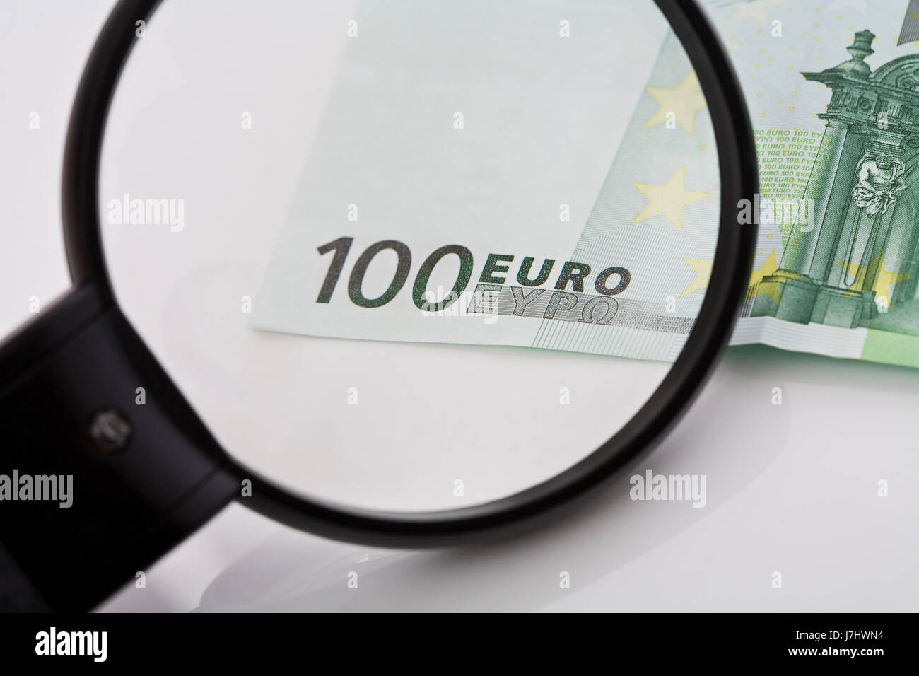 euro under the magnifying glass Stock Photo - Alamy