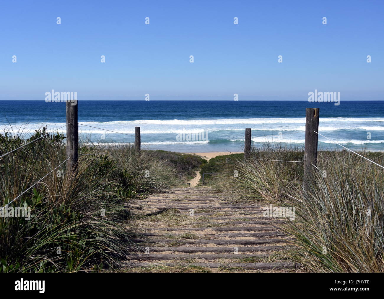 Sea beach wooden walkway, path entrance. Sandy ocean beach entrance ...