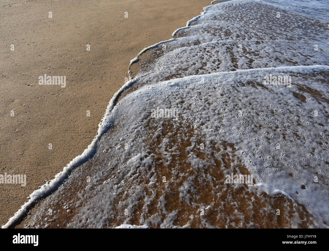 Wave and sand beach for background. Beautiful beach surface texture ...