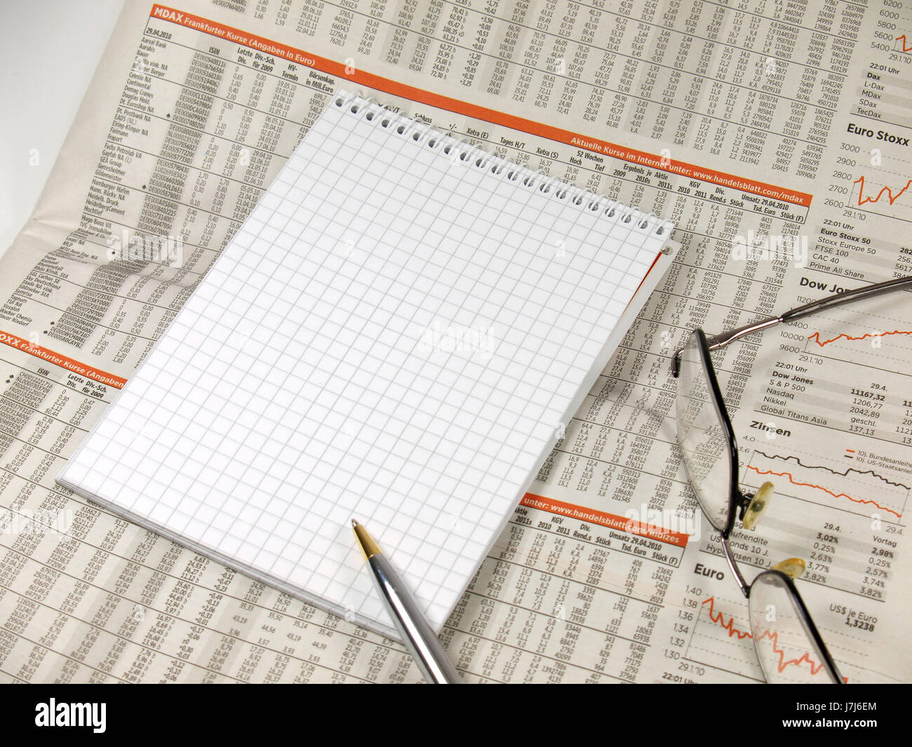 newspaper journal object underling writing pad reading glasses economy ...