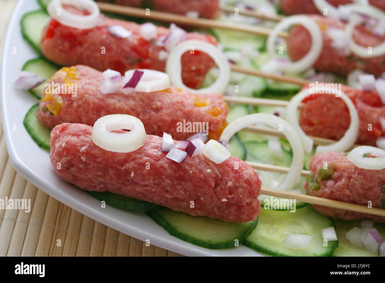 mincemeat skewer fresh pig meat food aliment prepare dainty cucumber ...