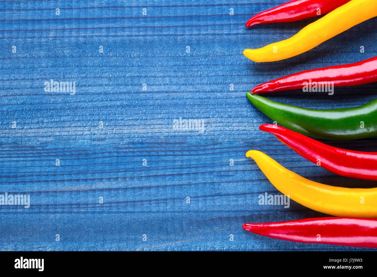 cayenne chilli peppers on wooden background. image with copy space ...