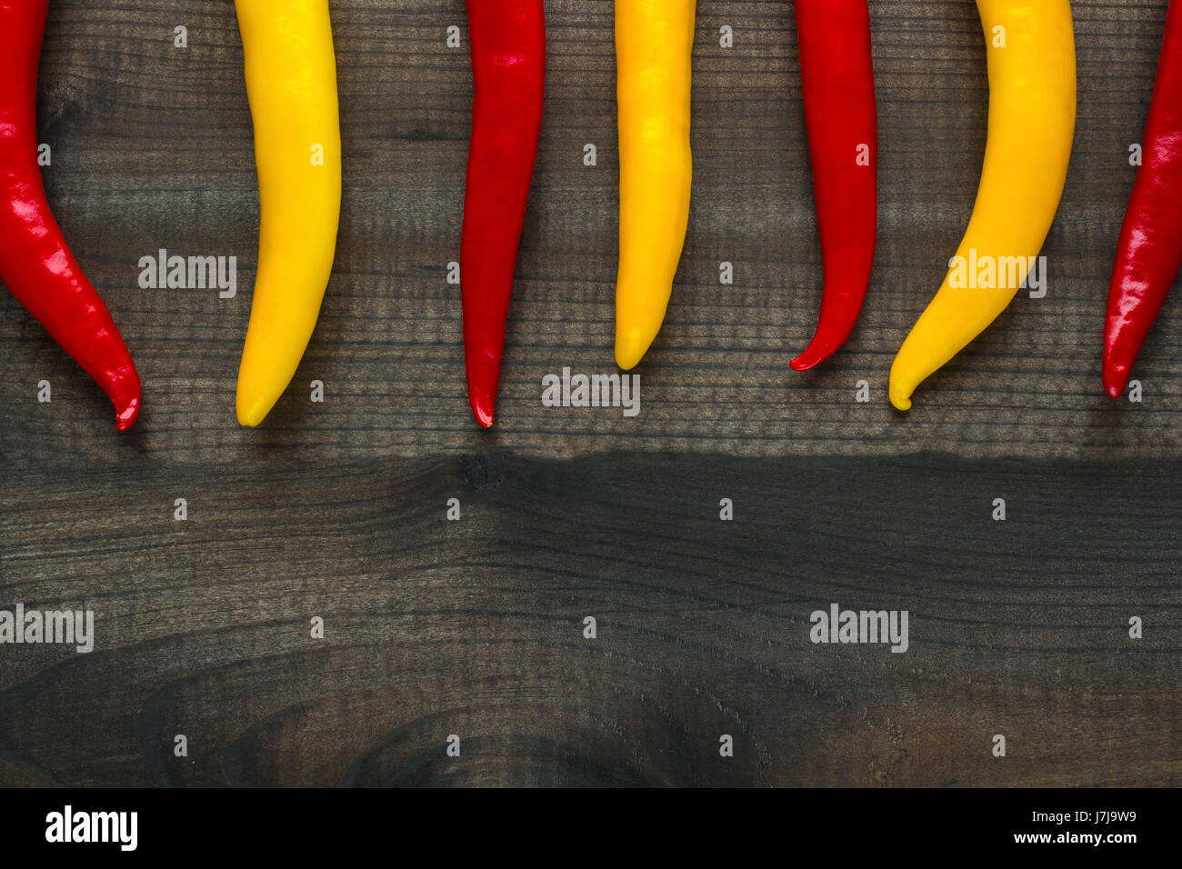 cayenne chilli peppers on wooden background. image with copy space ...