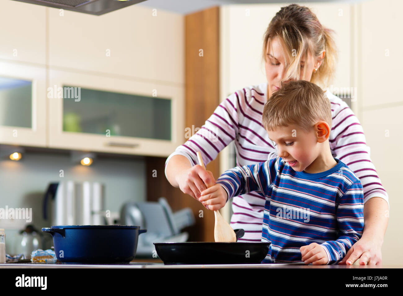 family cooking in kitchen Stock Photo - Alamy