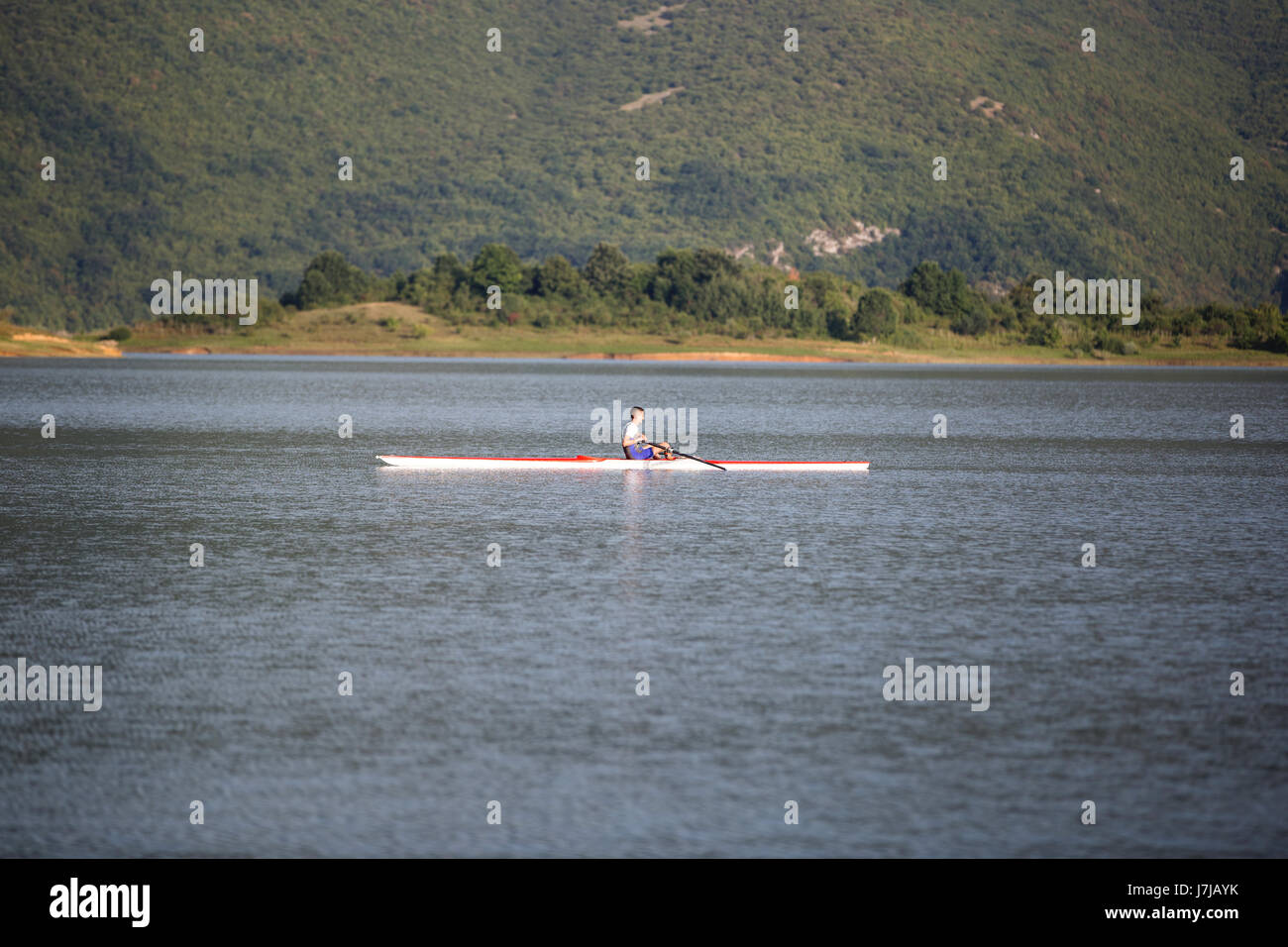Single scull rowing competitor paddles hi-res stock photography and ...