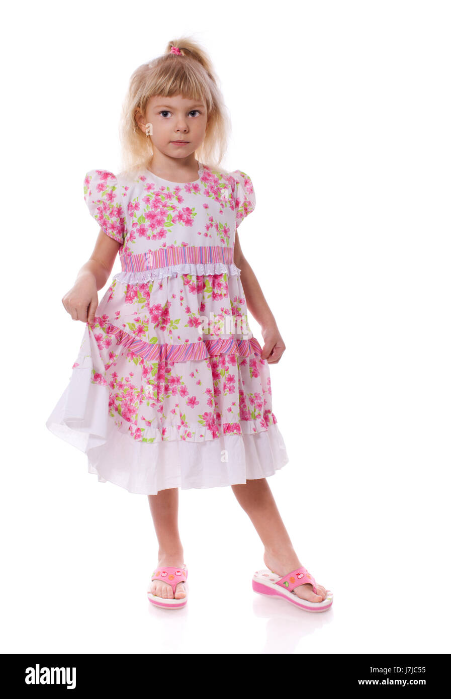 Cheerful girl wearing dress isolated on white Stock Photo - Alamy
