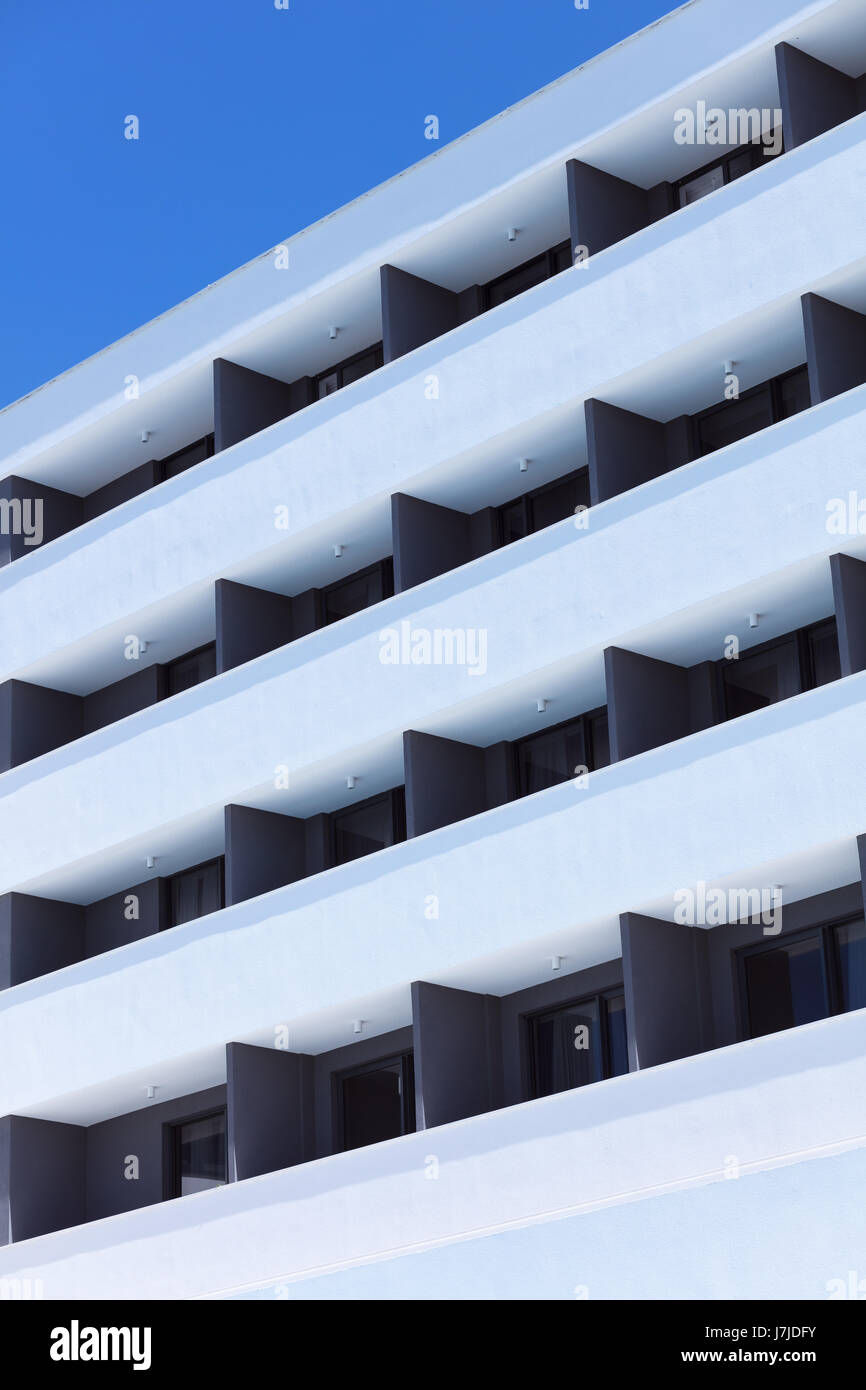 repeating pattern of windows and balcony. Building front Stock Photo ...