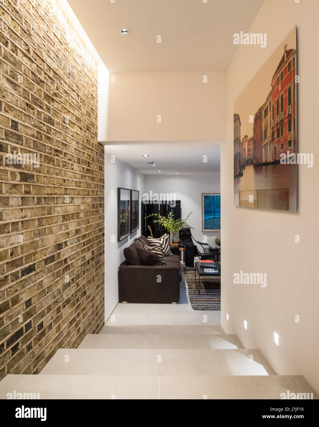 Exposed brick wall in hallway with photographic print of Venice bought ...