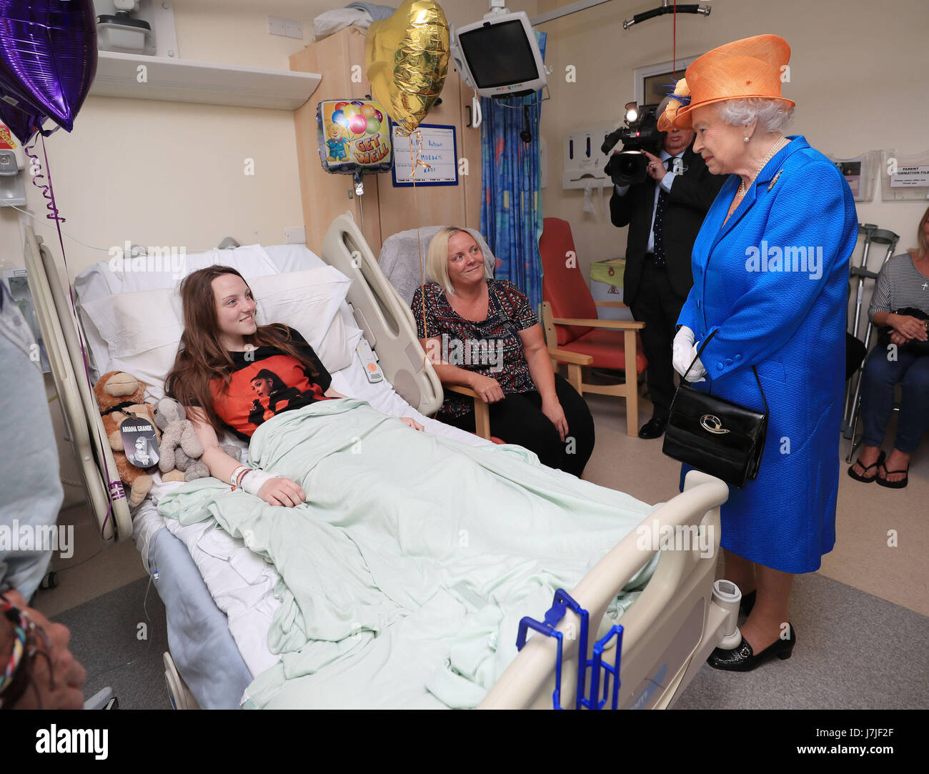 Queen Elizabeth II speaks to Millie Robson, 15, from Co Durham, and her ...