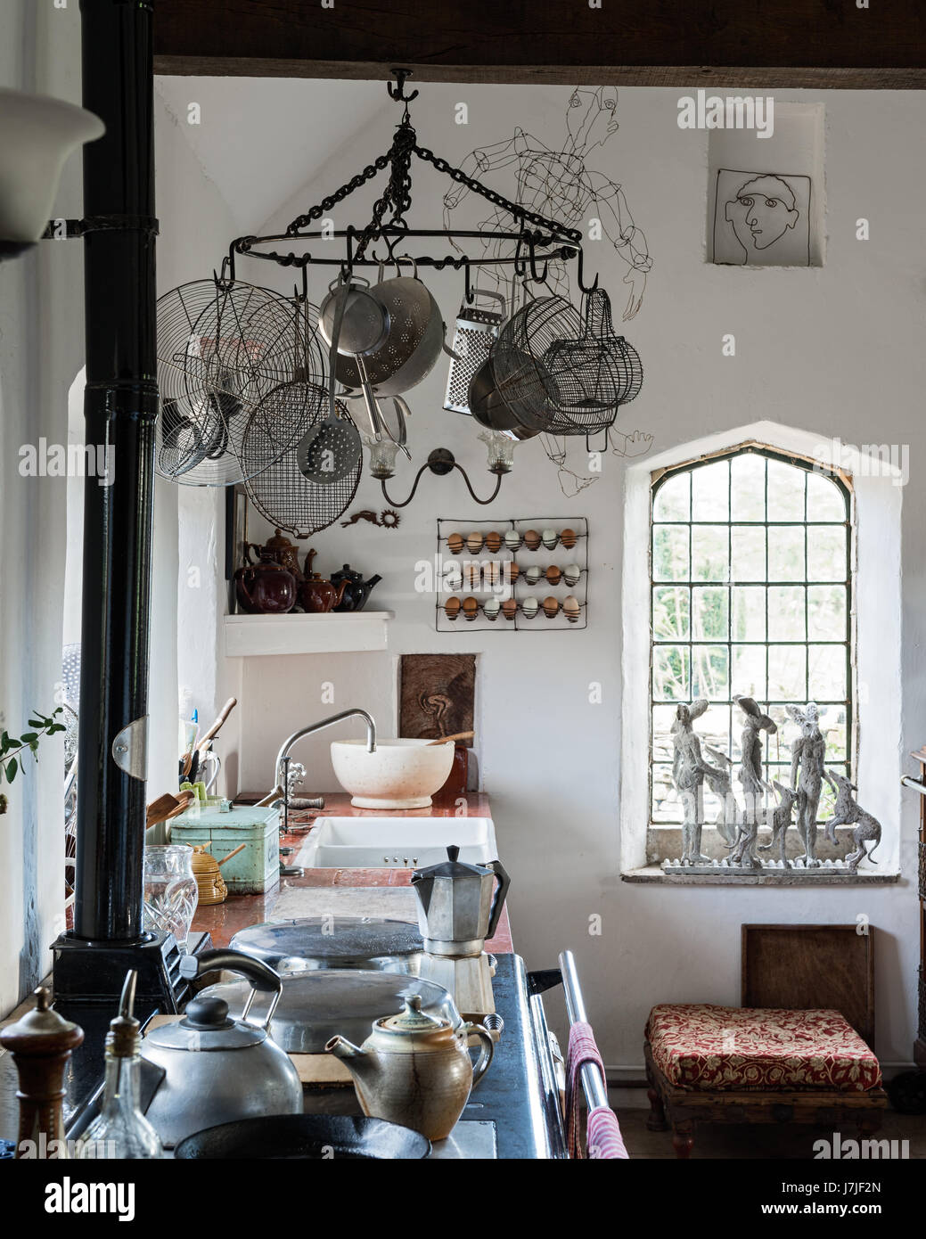 Rustic feeling kitchen with marble surfaces and aga adorned with Sophie ...