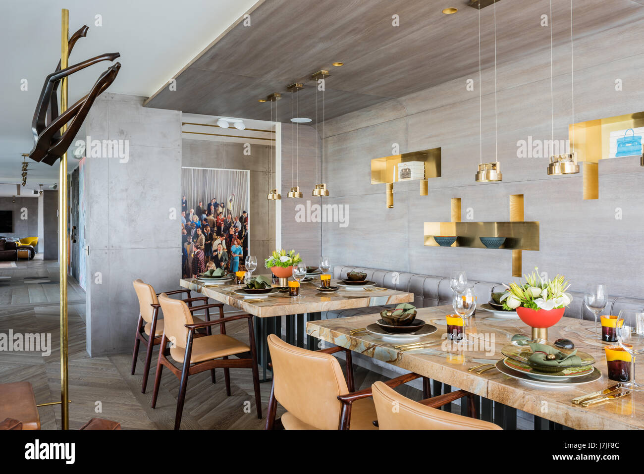 Laura Meroni brass hanging lights above custom made stonewood marble ...