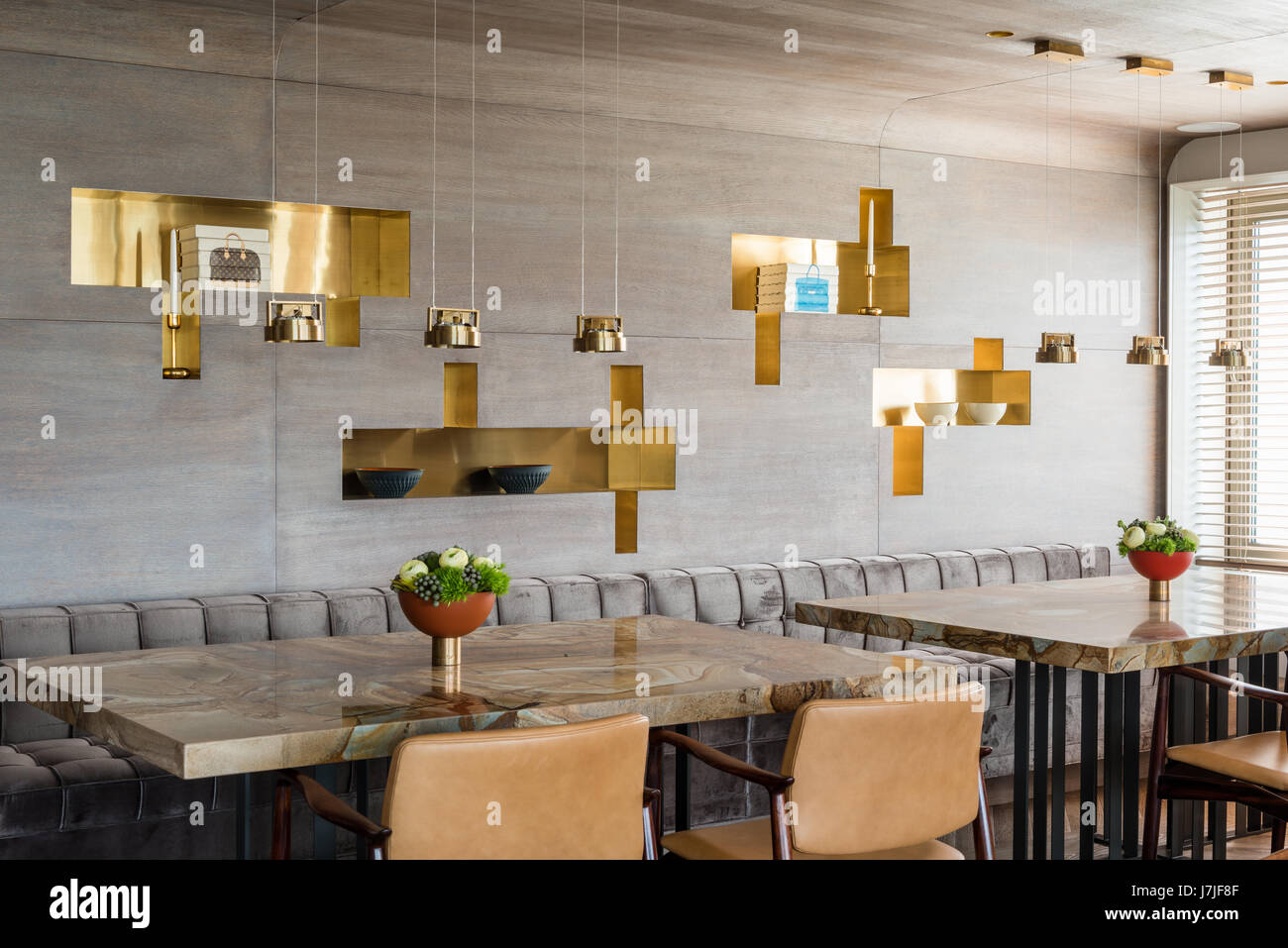 Laura Meroni brass hanging lights above custom made stonewood marble ...