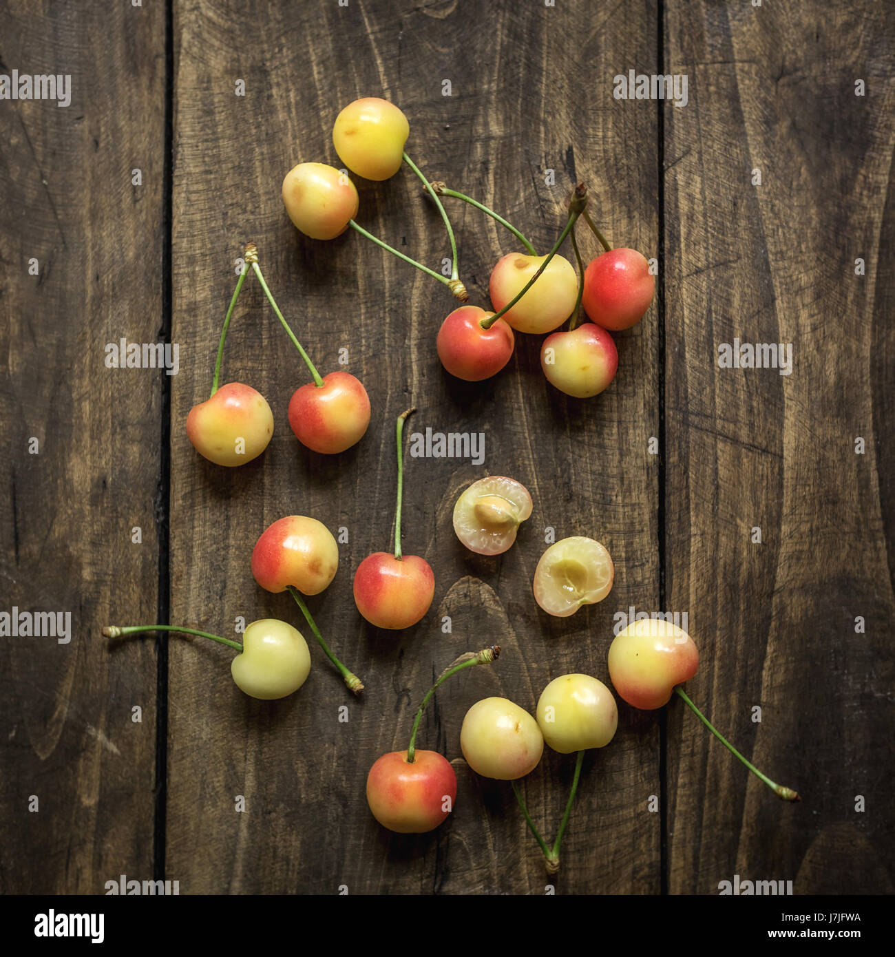 Cherries on a rustic table, from above Stock Photo - Alamy