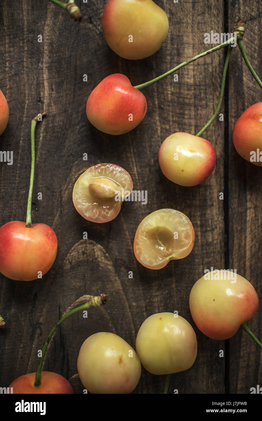 Cherries on a rustic table, from above Stock Photo - Alamy