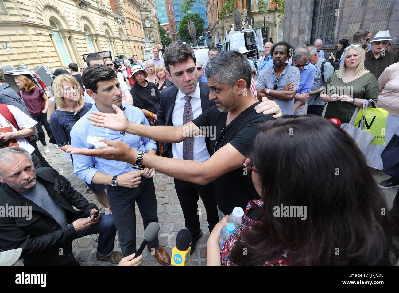 Mayor of Greater Manchester Andy Burnham comforts Hashim Norat as he is ...
