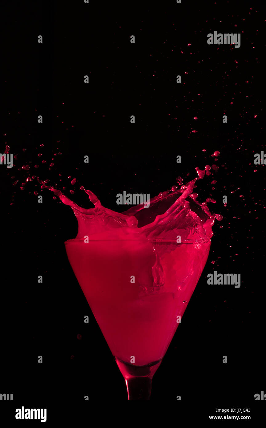 splashes of red color on black background Stock Photo - Alamy