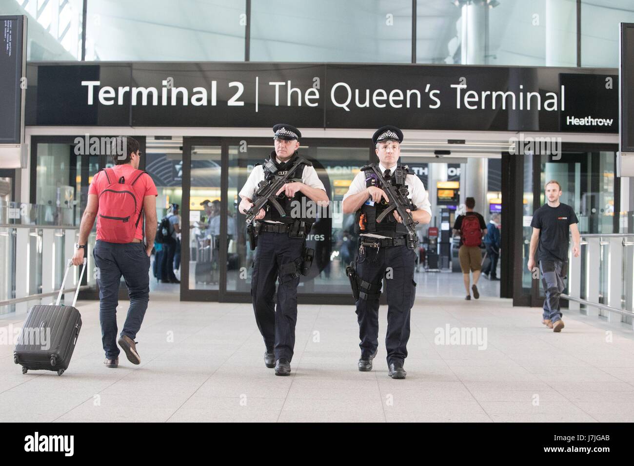 Police officers carry out a patrol in Terminal 2 at Heathrow Airport ...