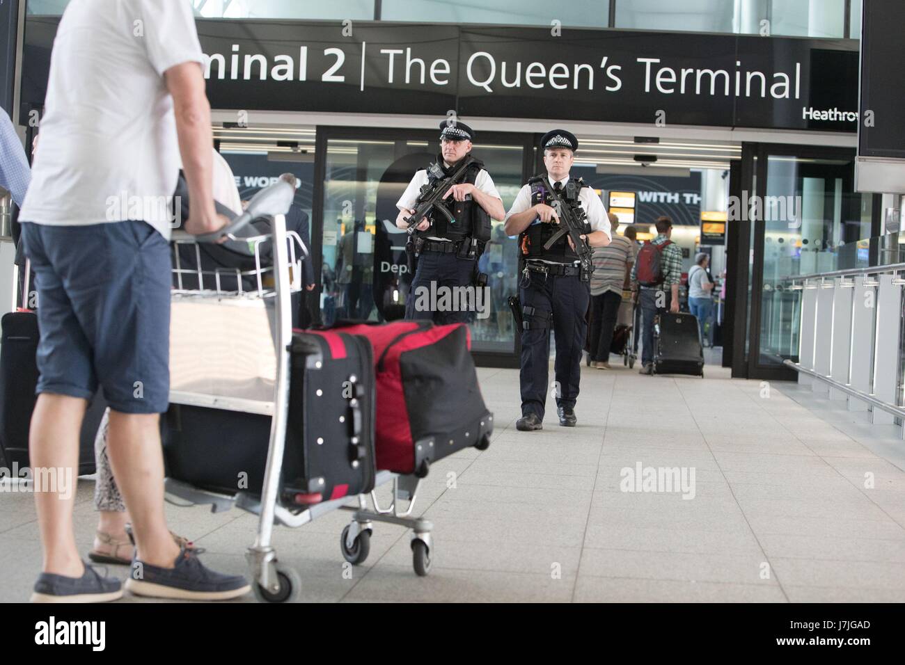 Police officers carry out a patrol in Terminal 2 at Heathrow Airport ...