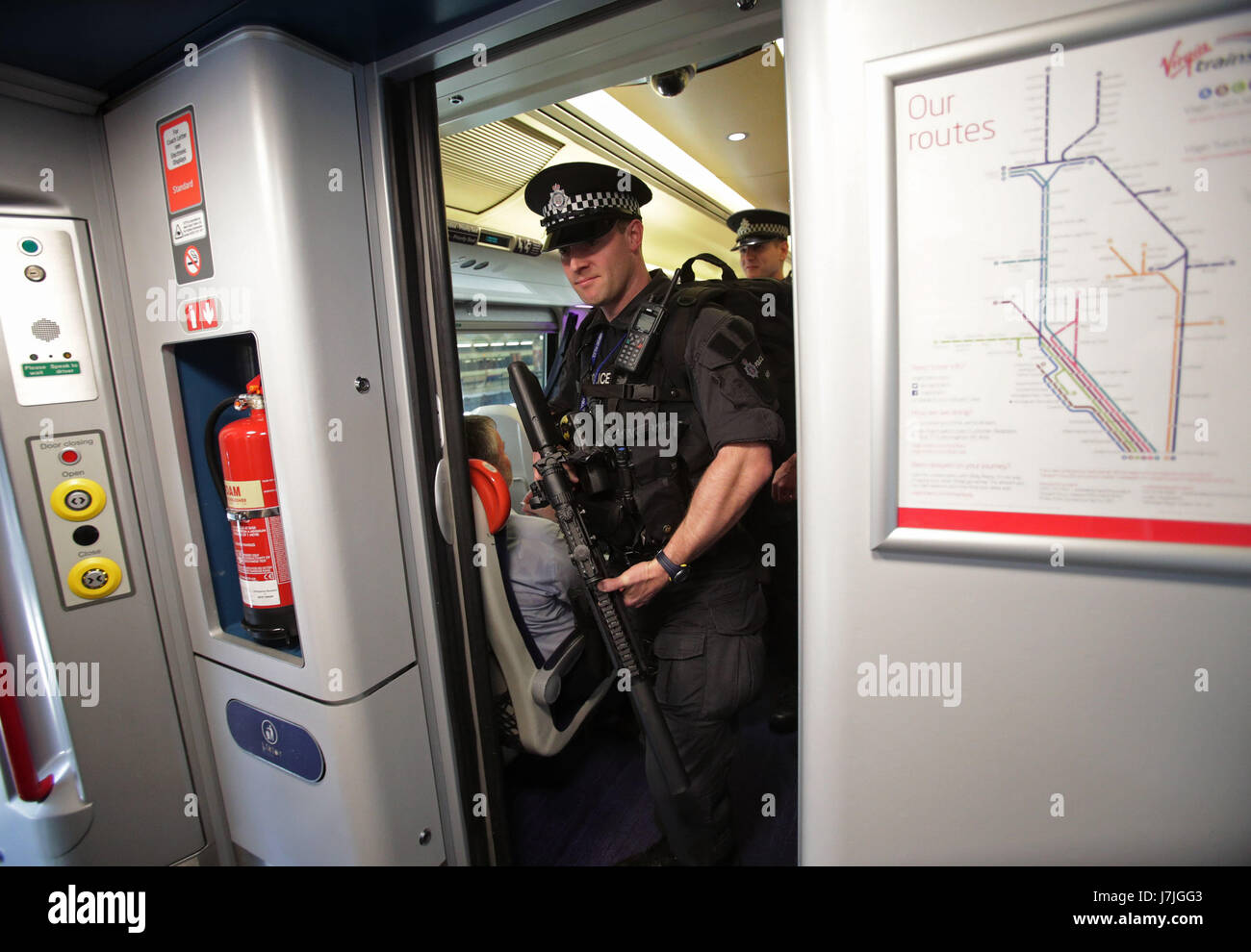 Armed British Transport Police Specialist Operations officers on board ...