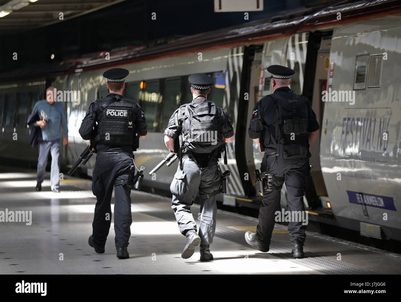 Armed British Transport Police Specialist Operations officers wait to ...