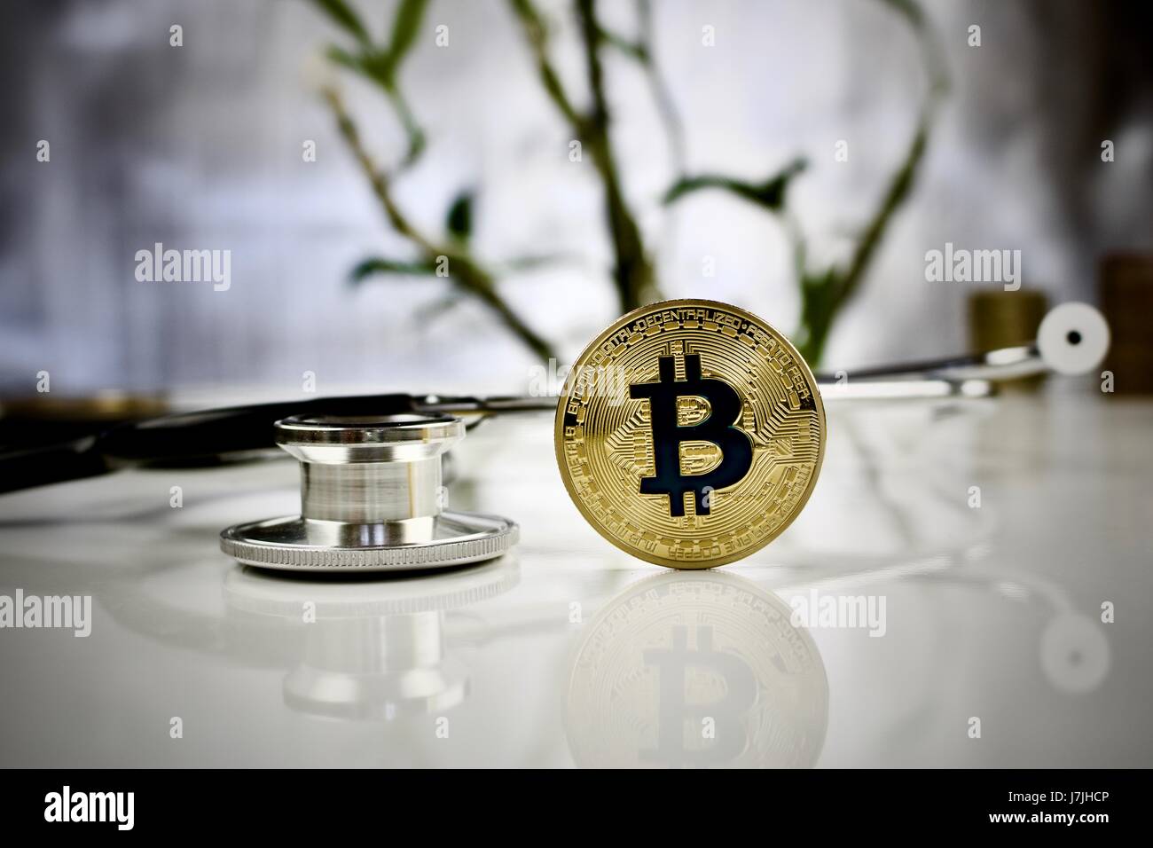 Digital currency physical gold bitcoin in medical concept Stock Photo ...