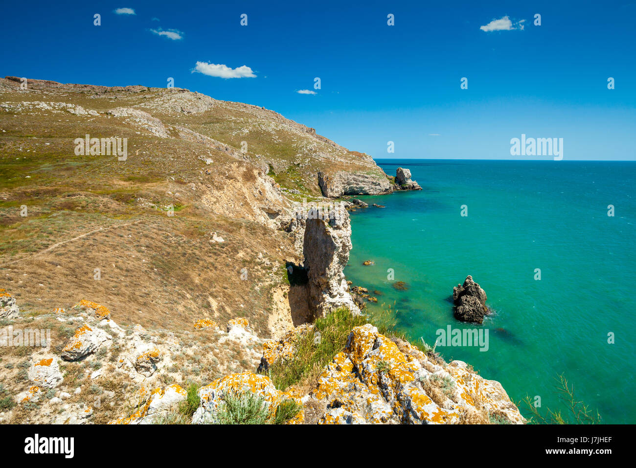 View of the open sea. Rocky seashore with blue sky. Beautiful nature ...