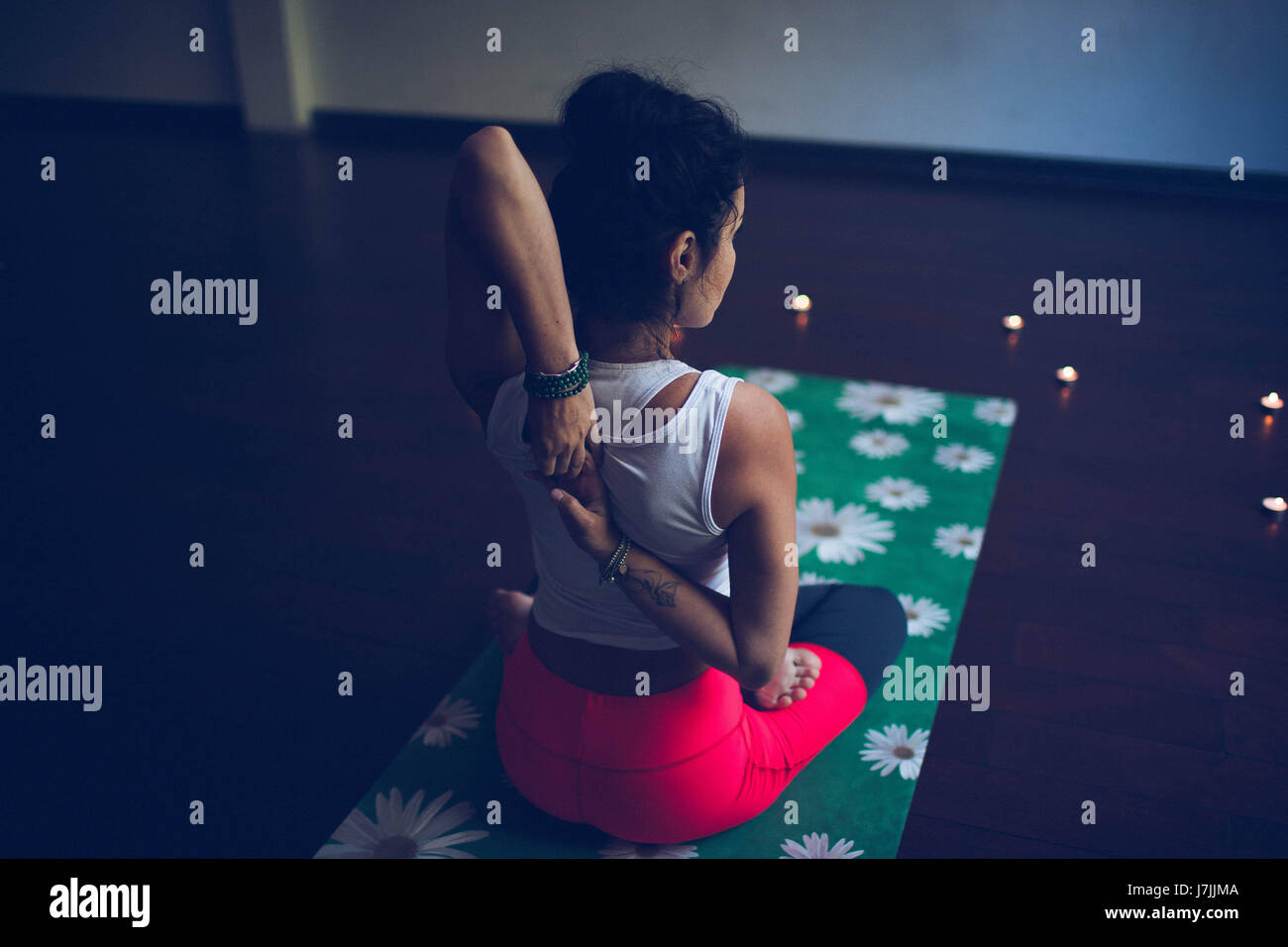 yoga instructor sits in asana Stock Photo - Alamy