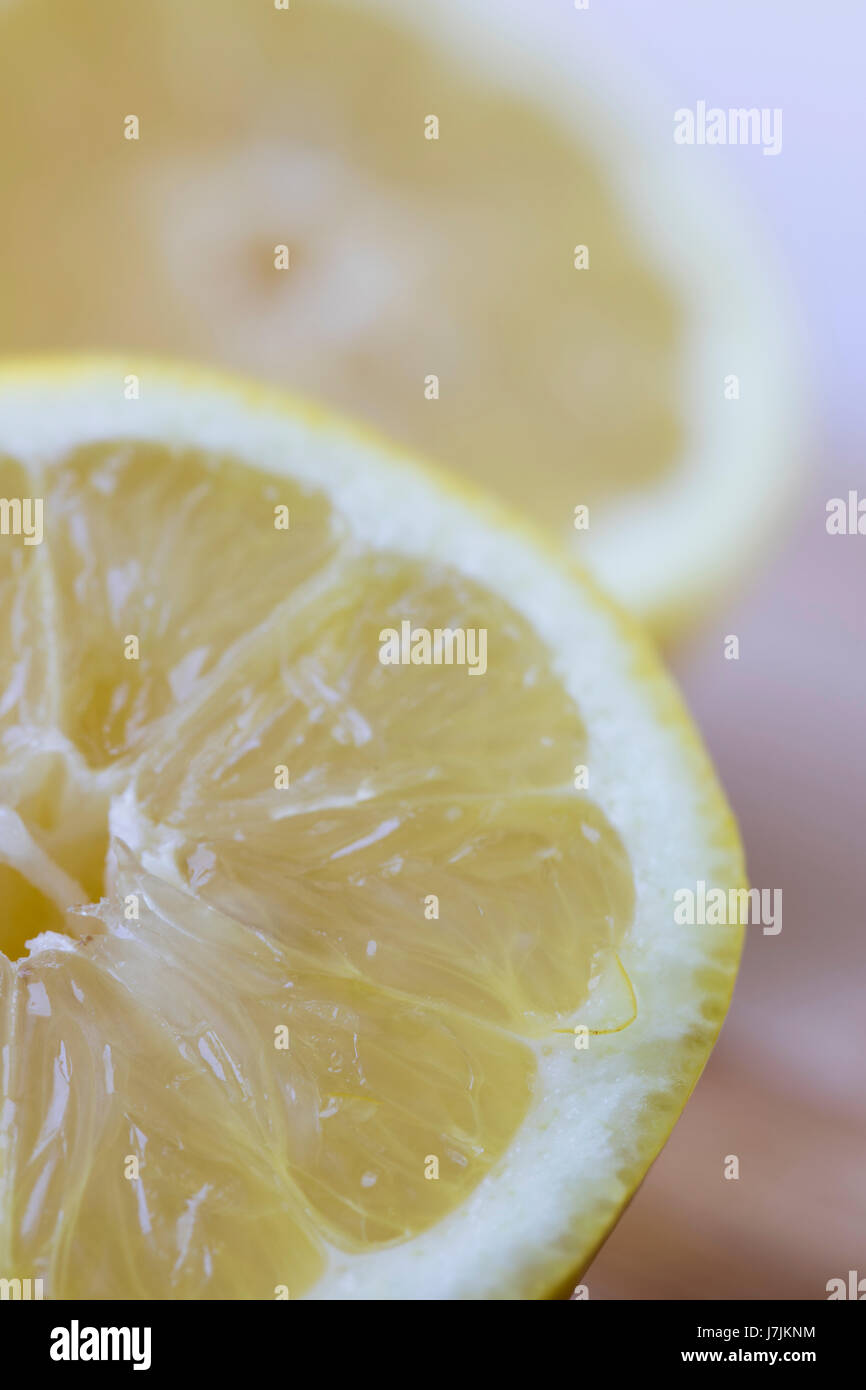 Close up of lemon sliced in half, vertical orientation Stock Photo - Alamy