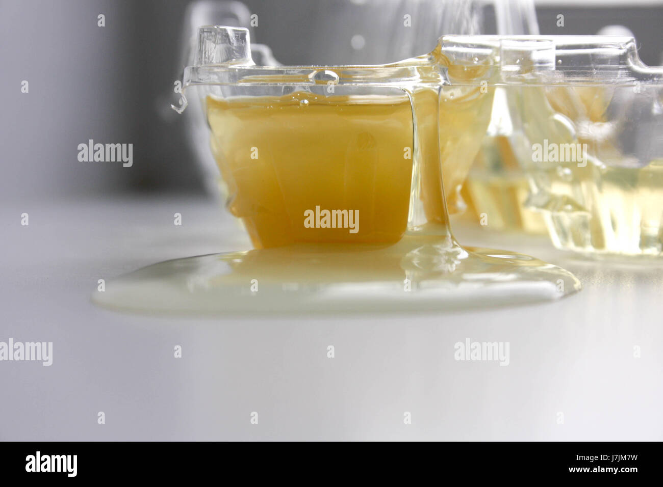 Egg yolk. Photo for your design. Raw egg inside. In a transparent ...