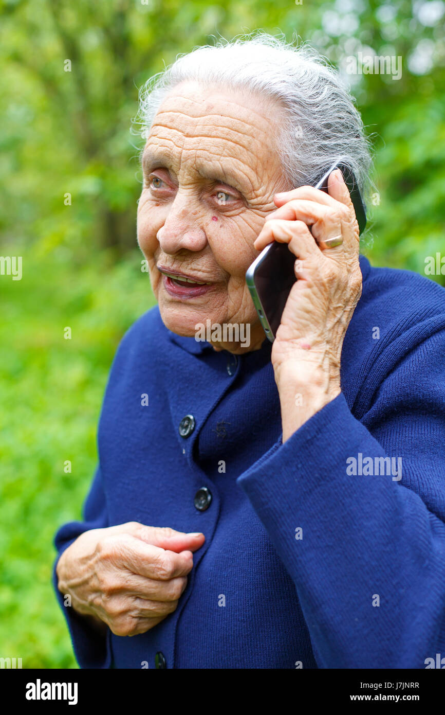Picture of a happy old woman, talking on the phone Stock Photo - Alamy
