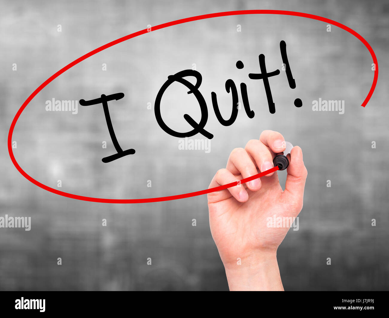 Man Hand writing I Quit! with black marker on visual screen. Isolated ...