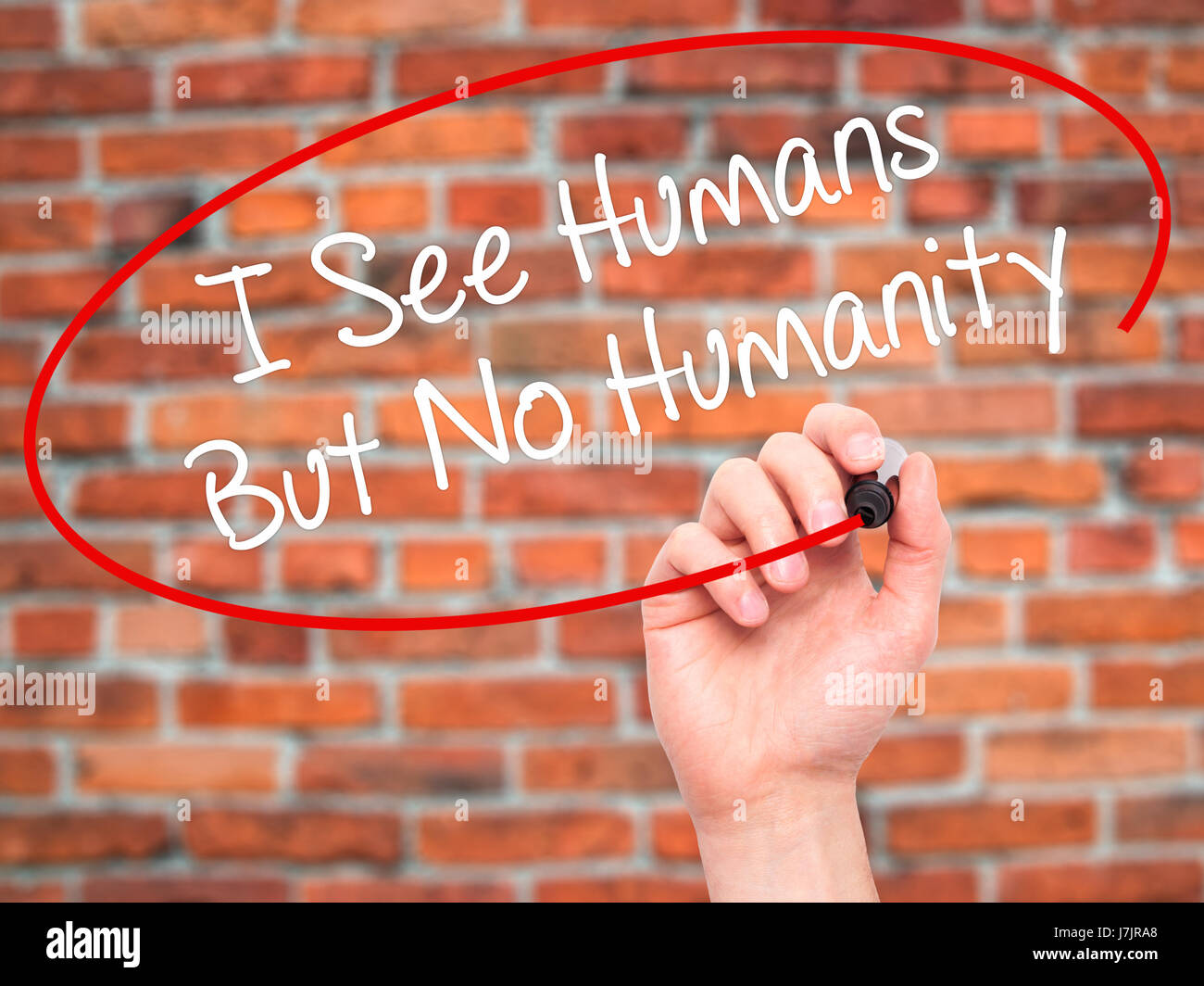 Man Hand writing I See Humans But No Humanity with black marker on ...