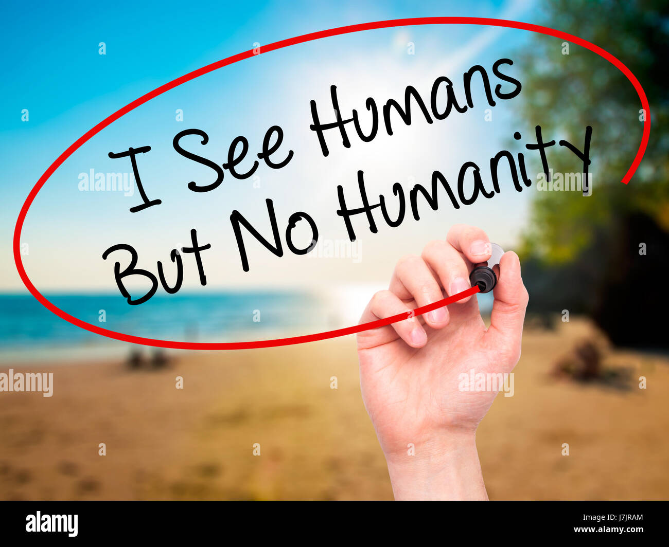 Man Hand writing I See Humans But No Humanity with black marker on ...