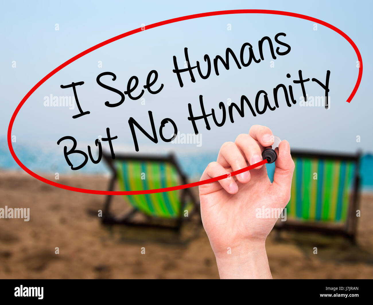 Man Hand writing I See Humans But No Humanity with black marker on ...